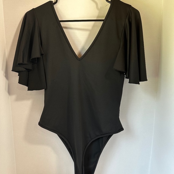M.M.Z | Tops | Mmz Plain Black Body Suit With Frilly Sleeves Size Large ...